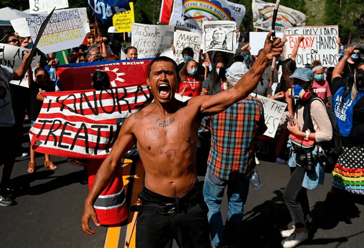 Native American protesters blocked the road leading up to Mount ...